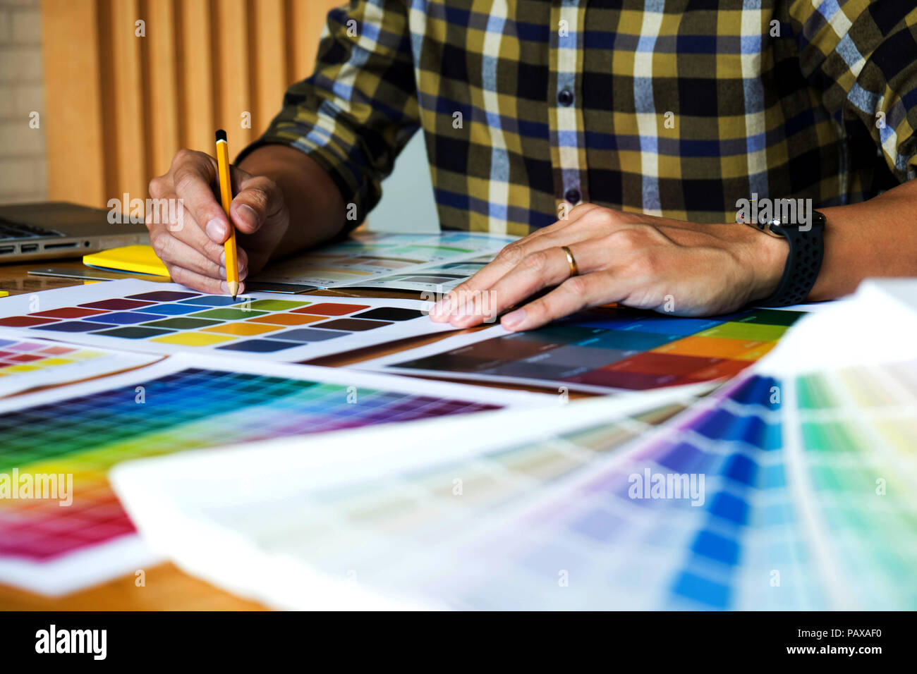 Graphic designers choose colors from the color bands samples for design ...