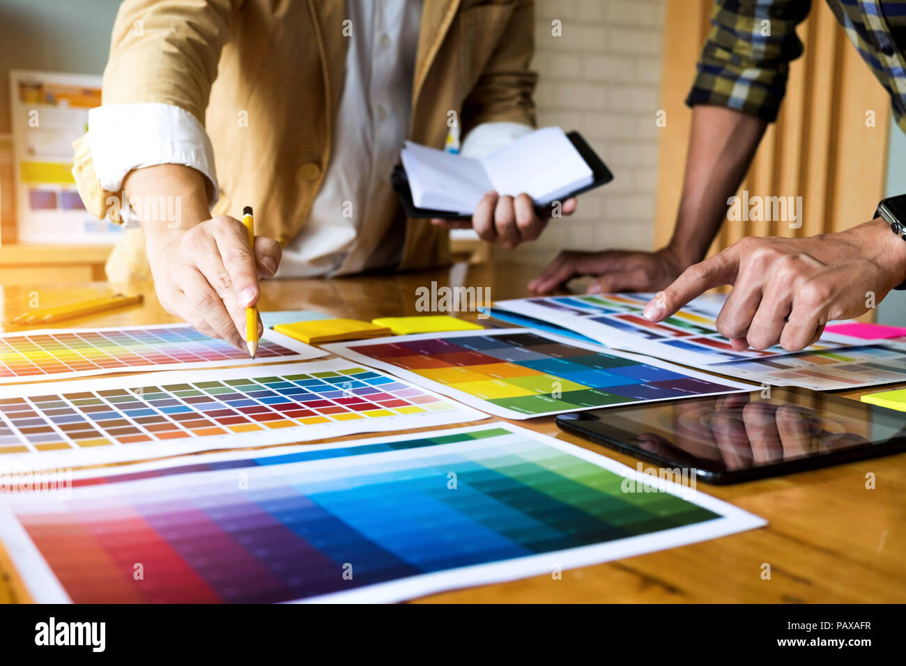 Graphic designers choose colors from the color bands samples for design ...