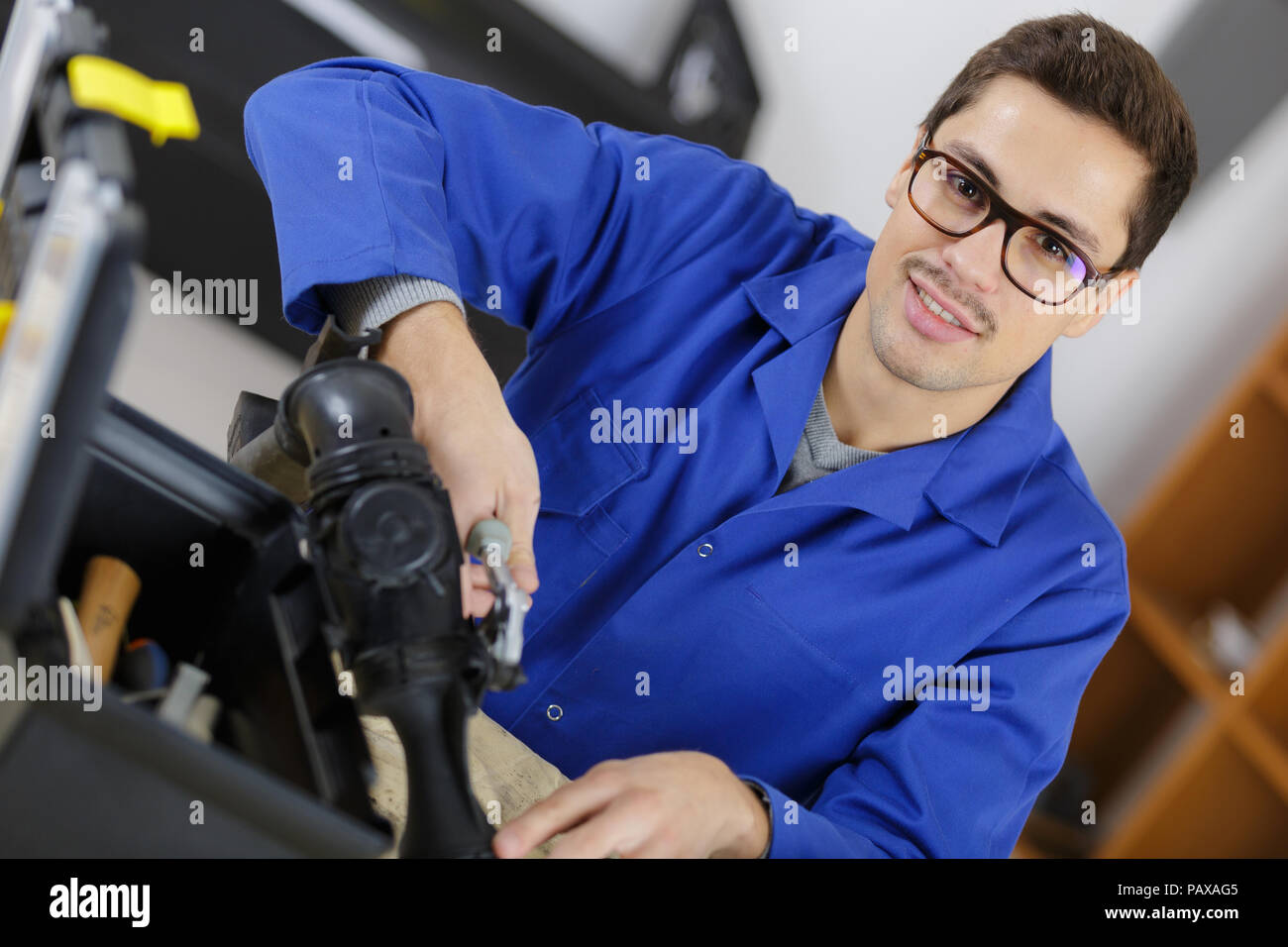 portrait of tradesman taking tools from toolbox Stock Photo - Alamy