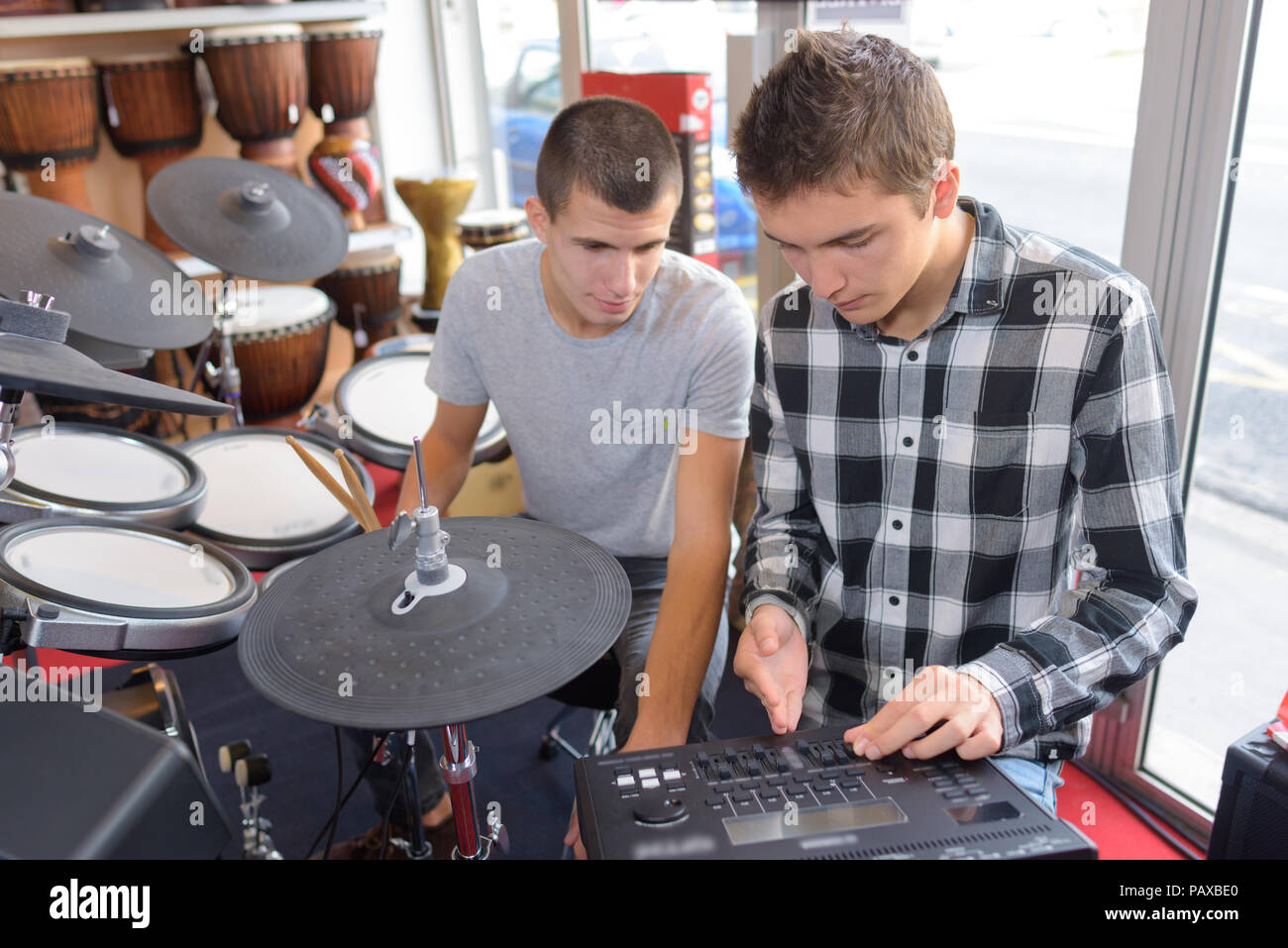 at the music store Stock Photo - Alamy