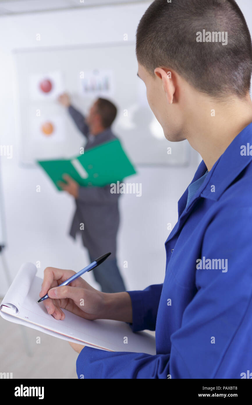 professional school student taking notes during class Stock Photo - Alamy