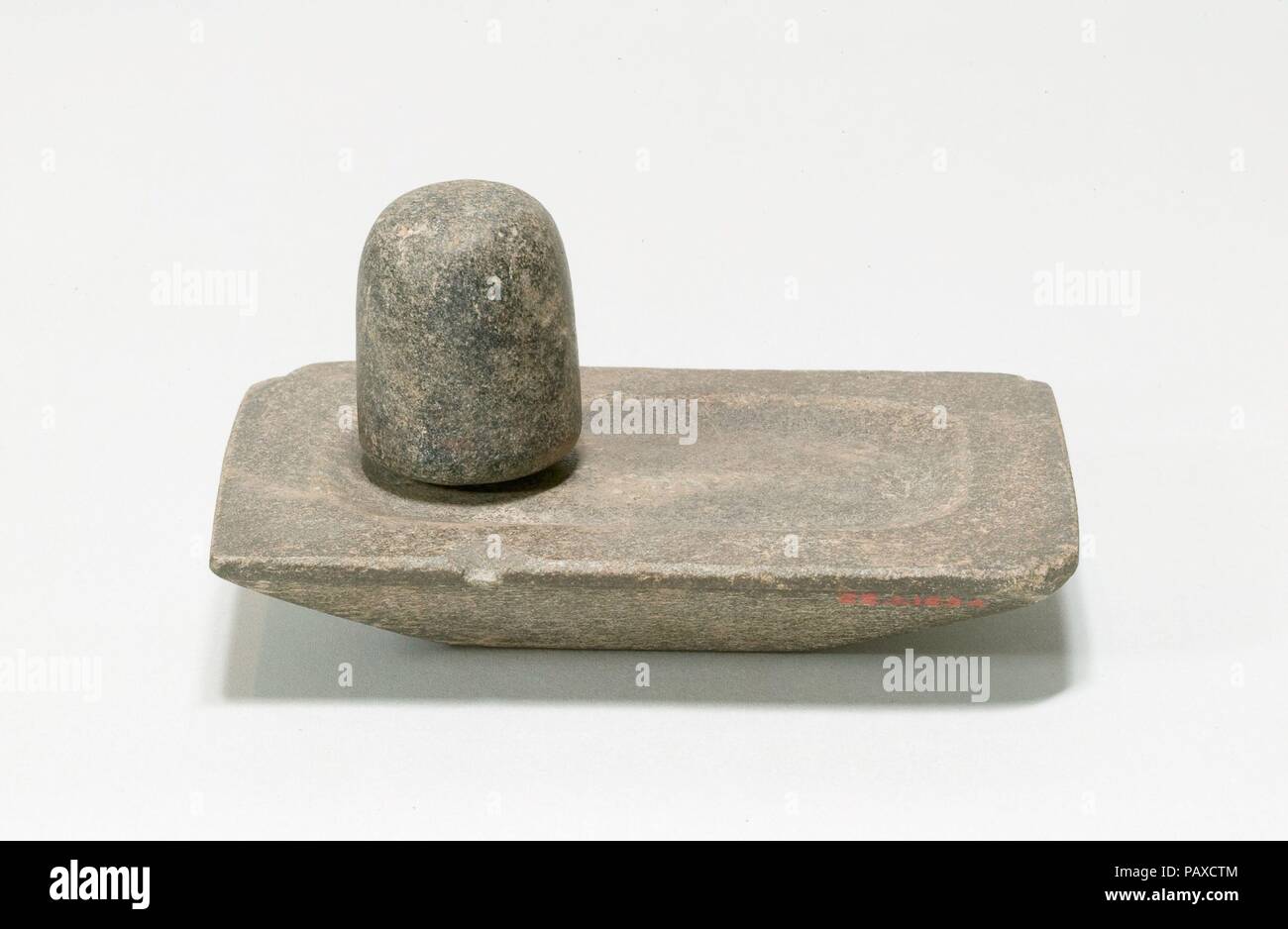 Slab and grinder. Dimensions: a) l. 10.4 cm (4 1/8 in); w. 6.7 cm (2 5/ ...