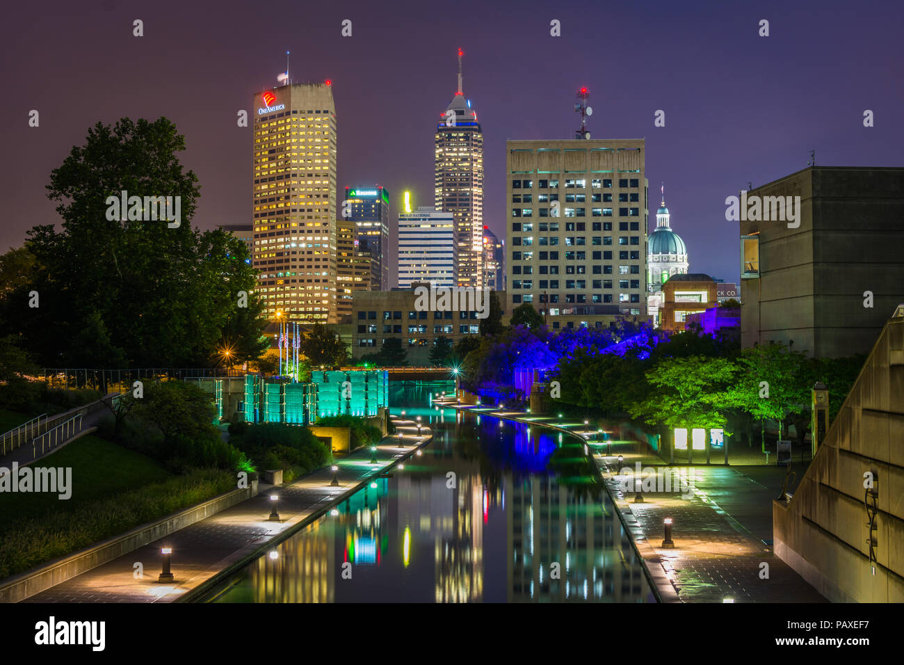 The Indiana Central Canal and downtown skyline at night in Indianapolis ...