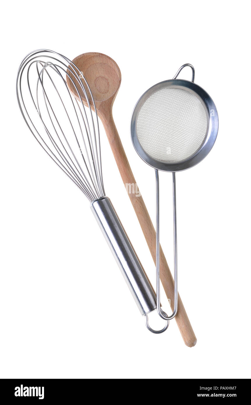 Whisk, wooden spoon, and a colander, isolated Stock Photo - Alamy