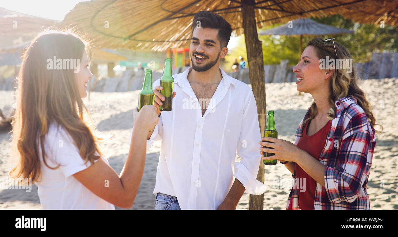 Group people partying tropical beach hi-res stock photography and ...