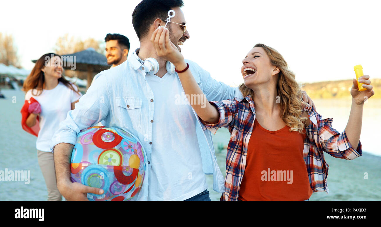 Happy friends laughing and smiling outdoors Stock Photo - Alamy