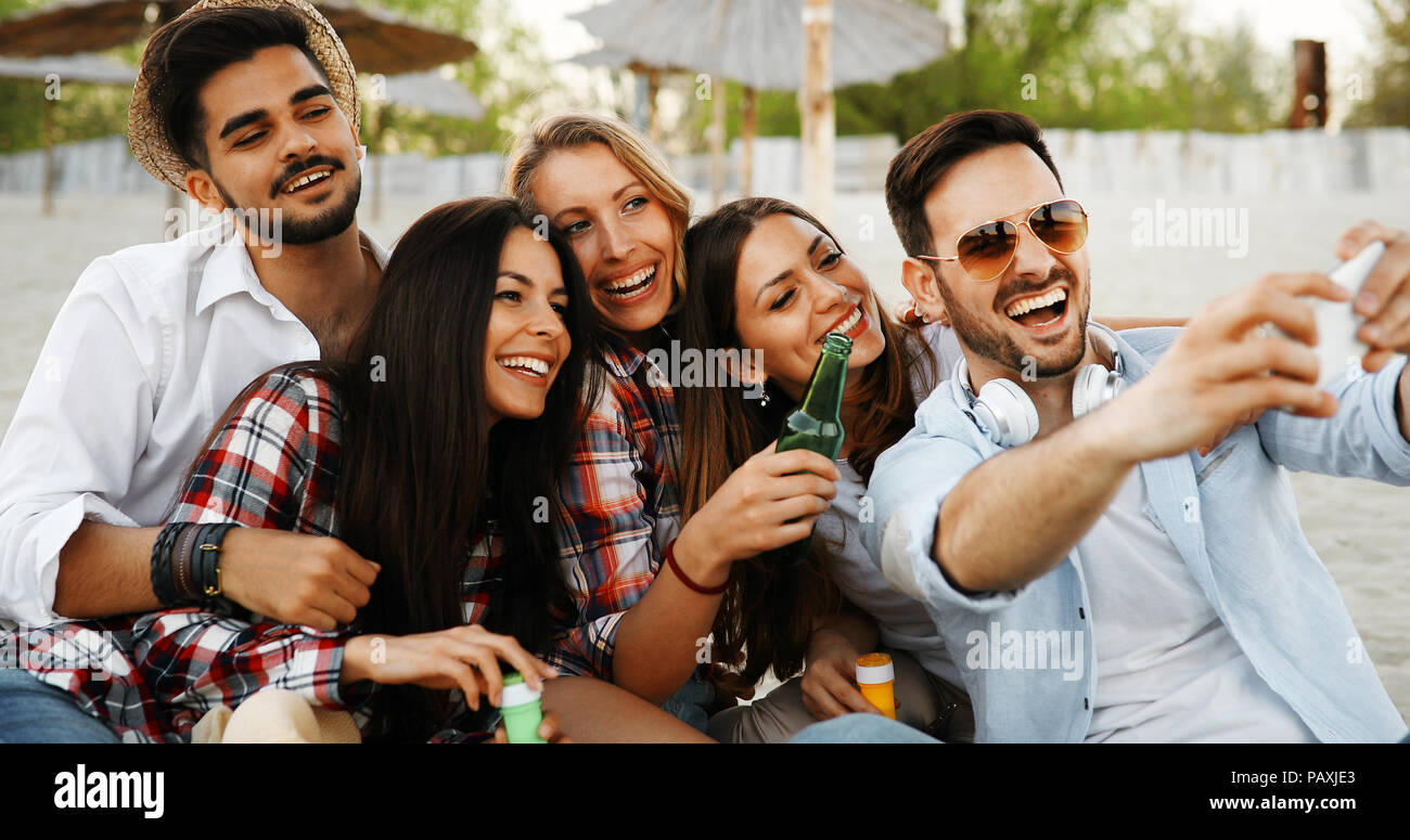 Happy friends laughing and smiling outdoors Stock Photo - Alamy