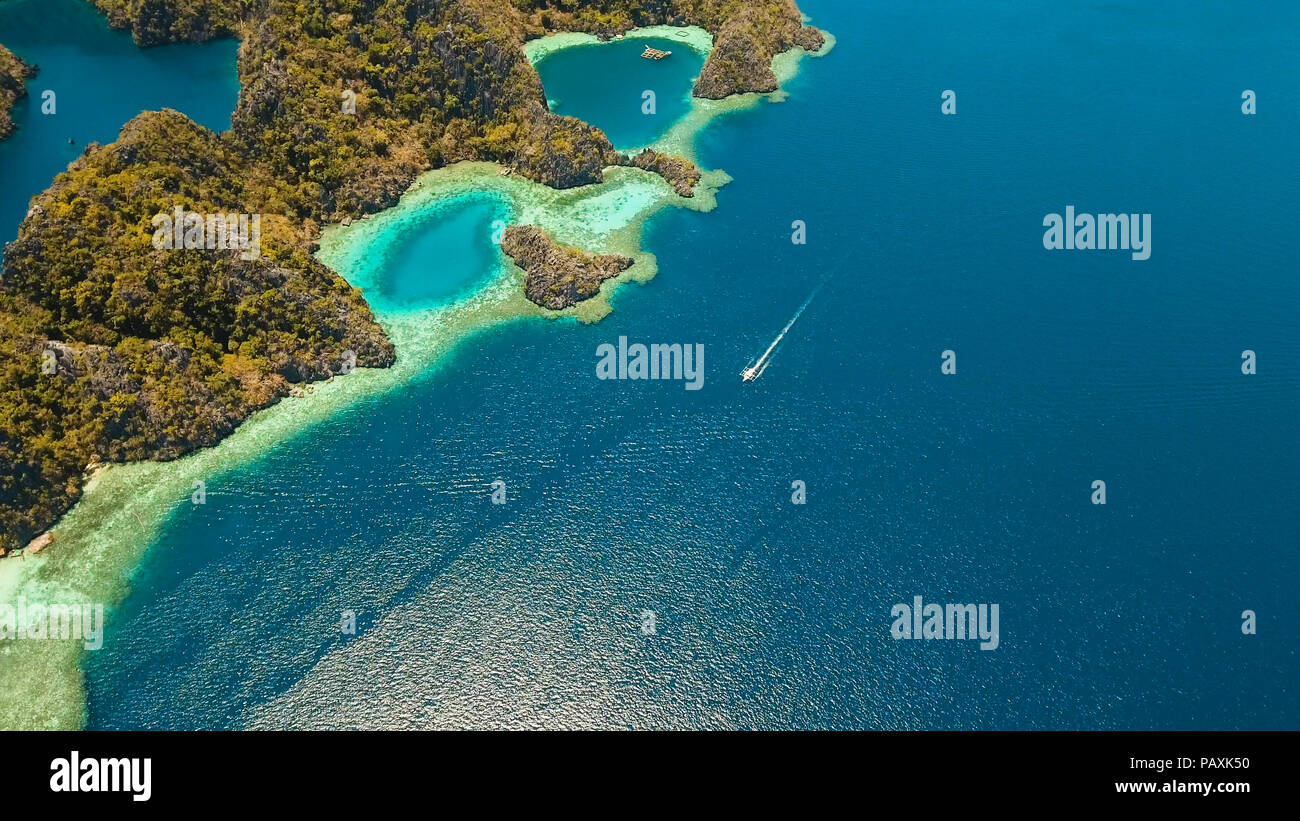 Aerial view: Lagoon with blue, azure water in the middle of small ...