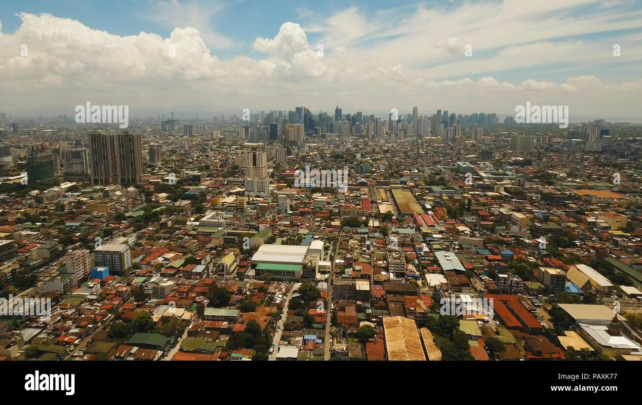 Aerial view of Manila city. Fly over city with skyscrapers and ...