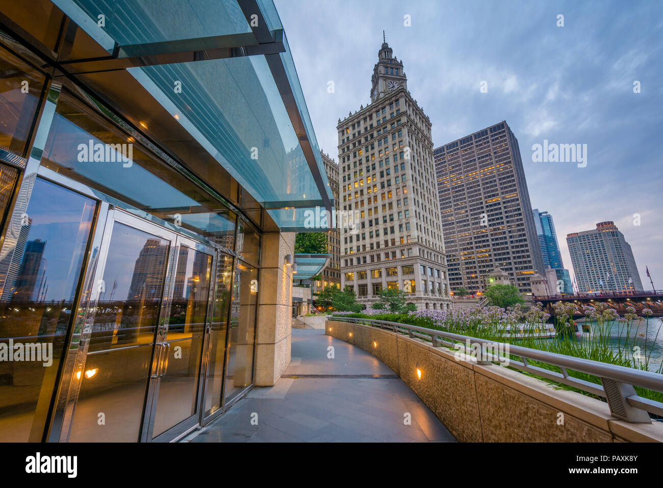 Walkway and modern buildings along the Chicago River, in Chicago ...