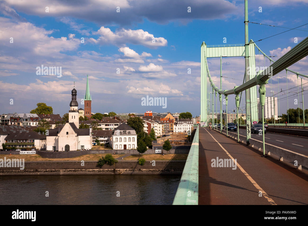 the Muelheimer bridge across the river Rhine, view to the church St ...