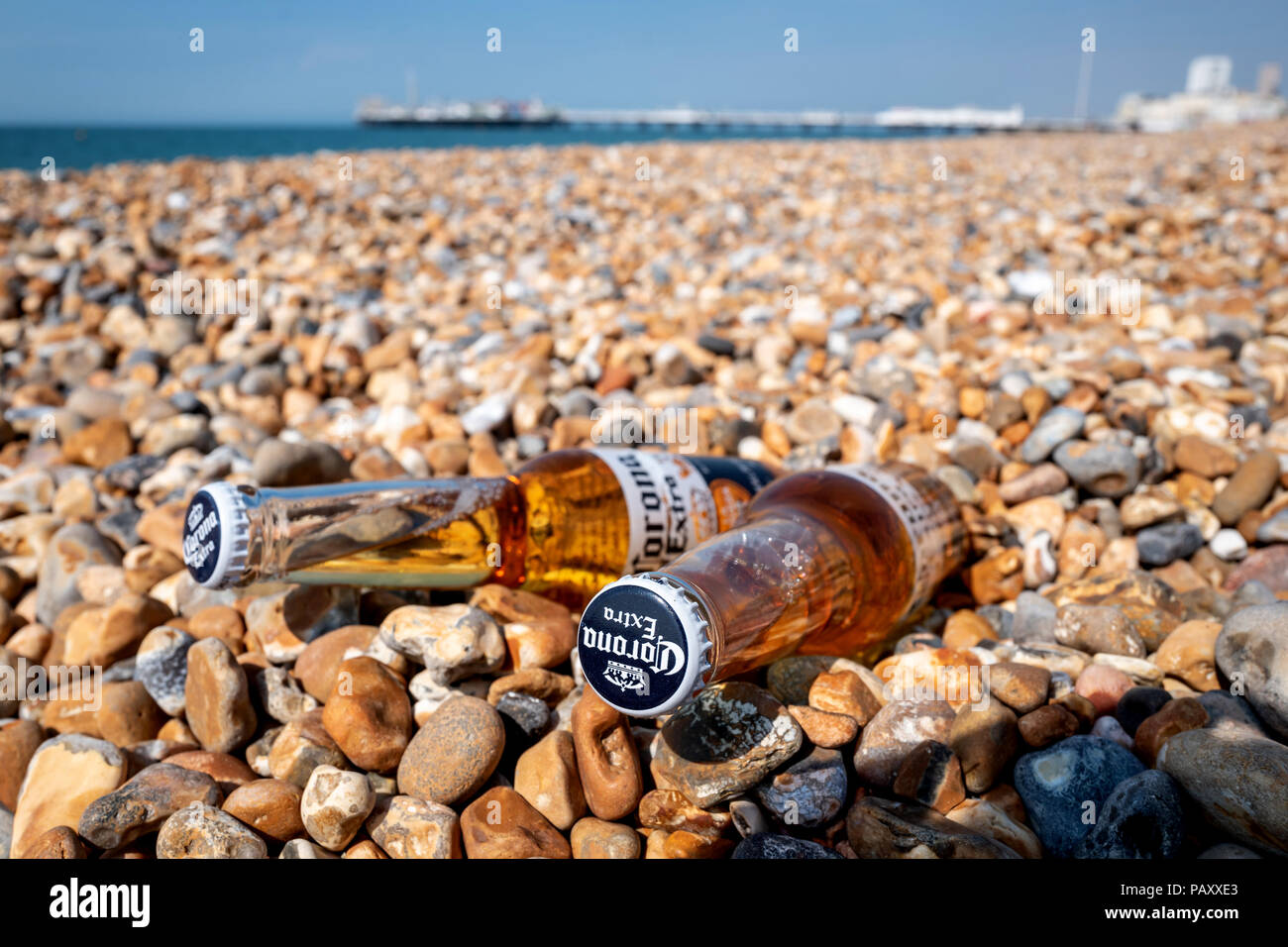 Abandoned beer bottles on Brighton beach Stock Photo - Alamy