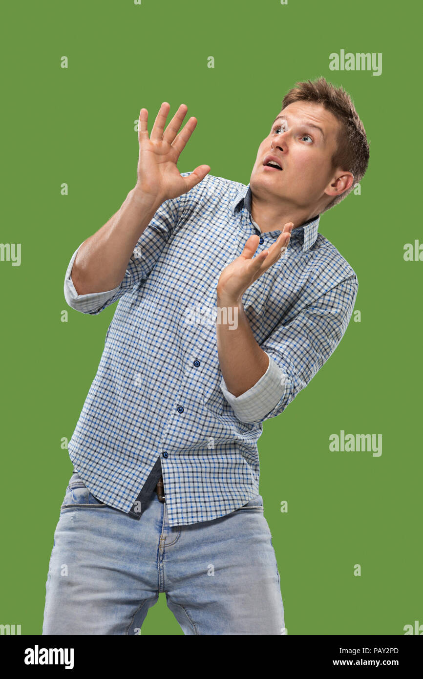 Portrait of the scared man on green Stock Photo - Alamy