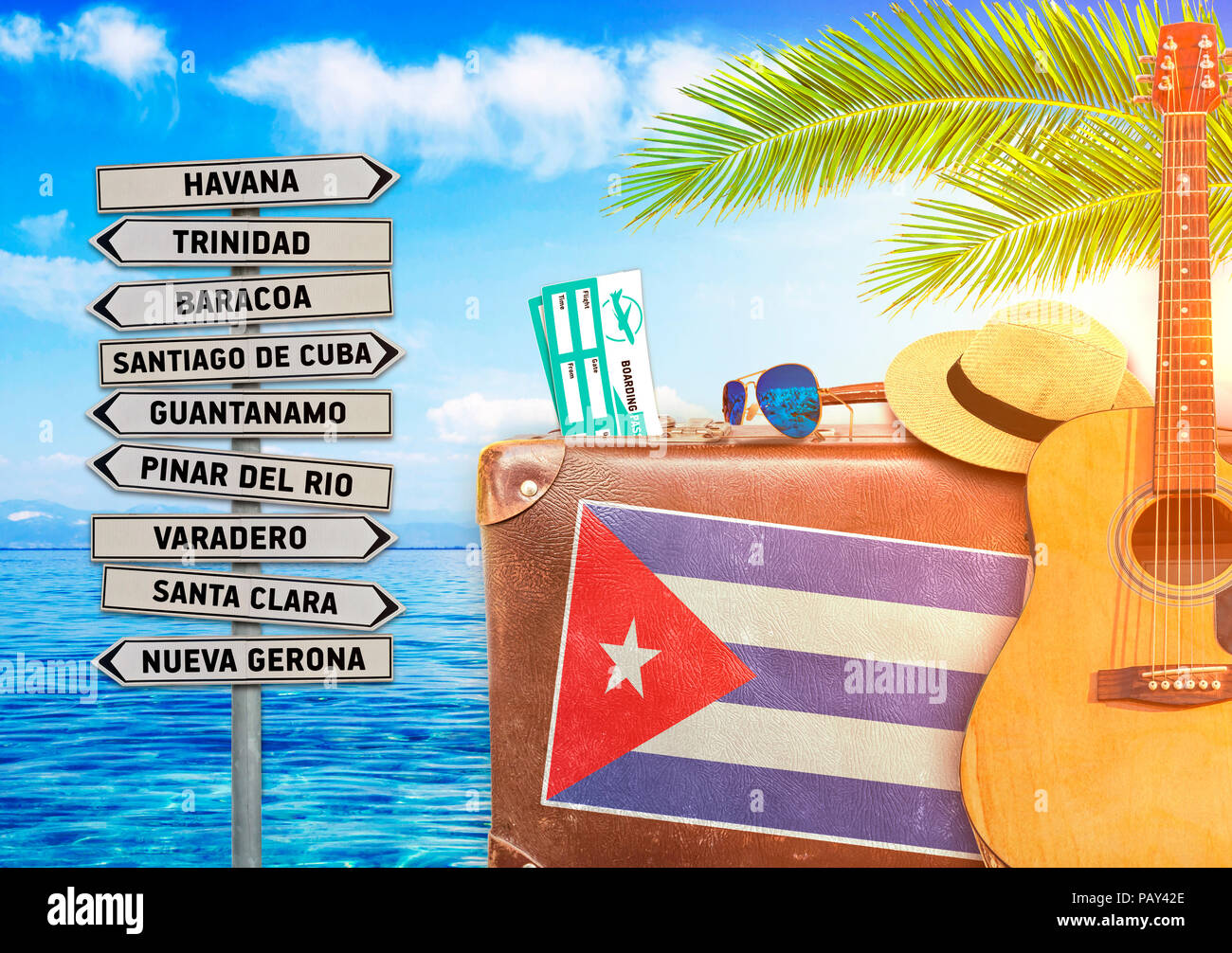 Concept of summer traveling with old suitcase and Cuba town sign Stock ...