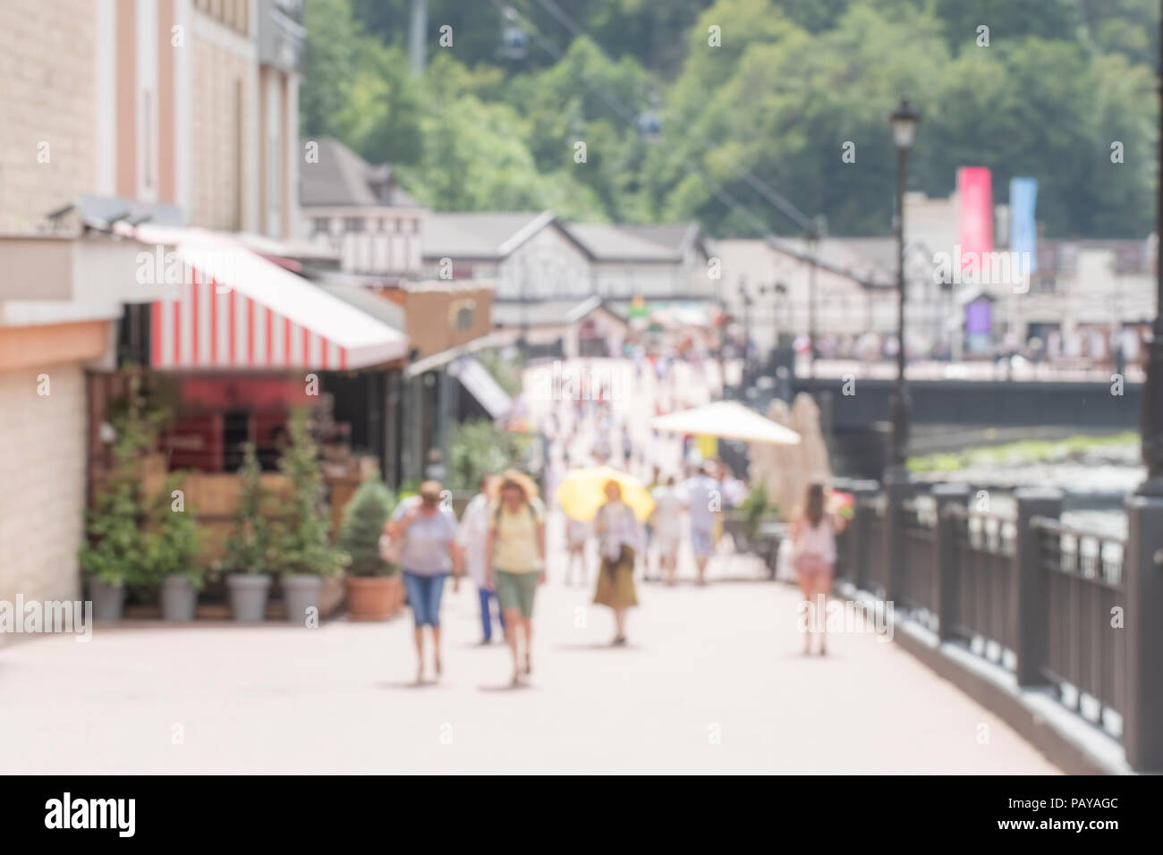 People walking on the promenade- blurred background Stock Photo - Alamy