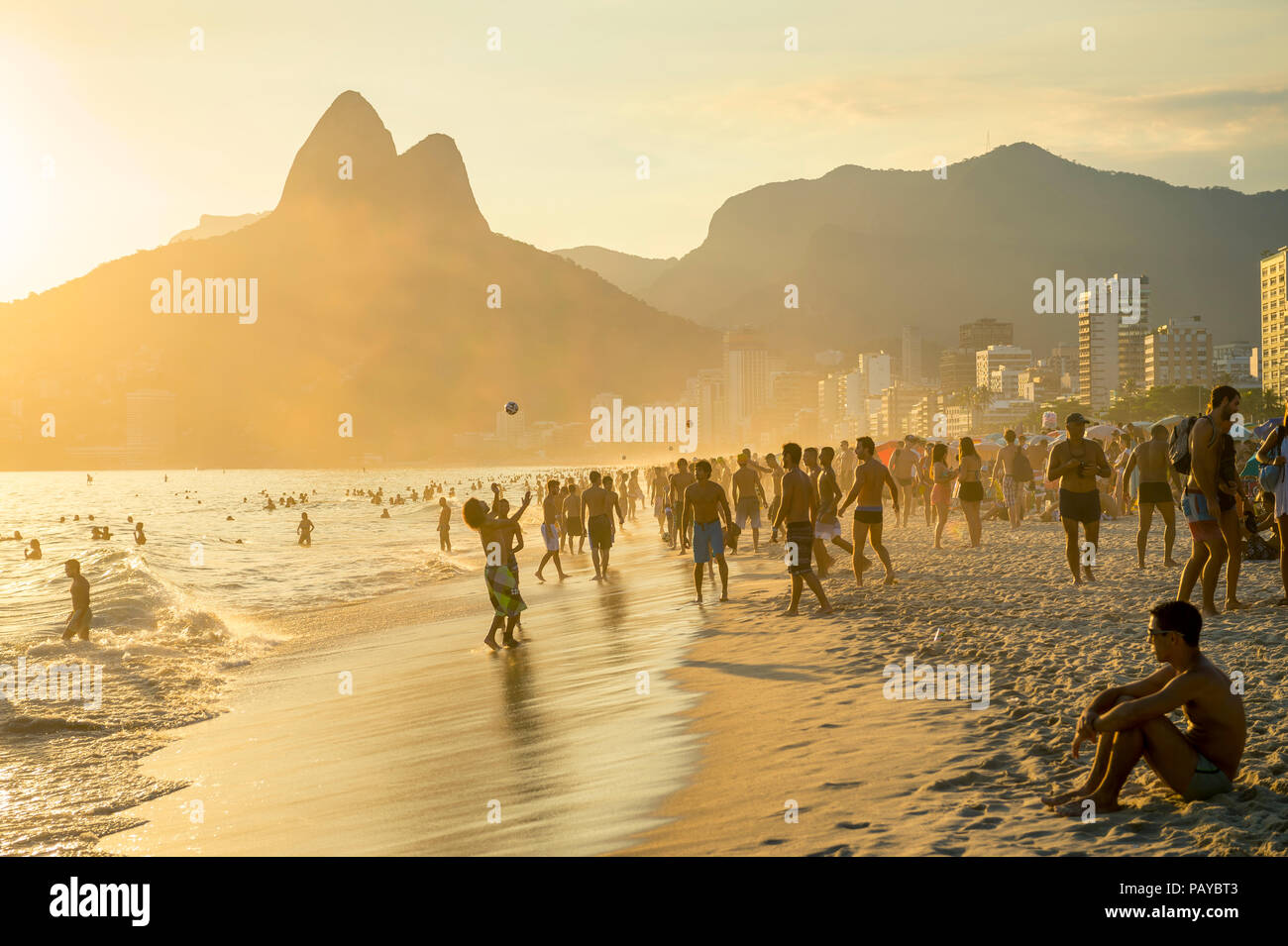 RIO DE JANEIRO - CIRCA JANUARY, 2014: Beachgoers on Ipanema Beach sit ...