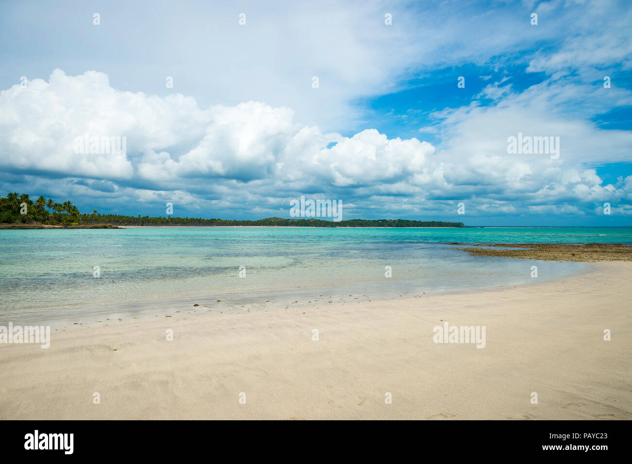 View of a remote Brazilian beach with calm lagoon water and shadows of ...