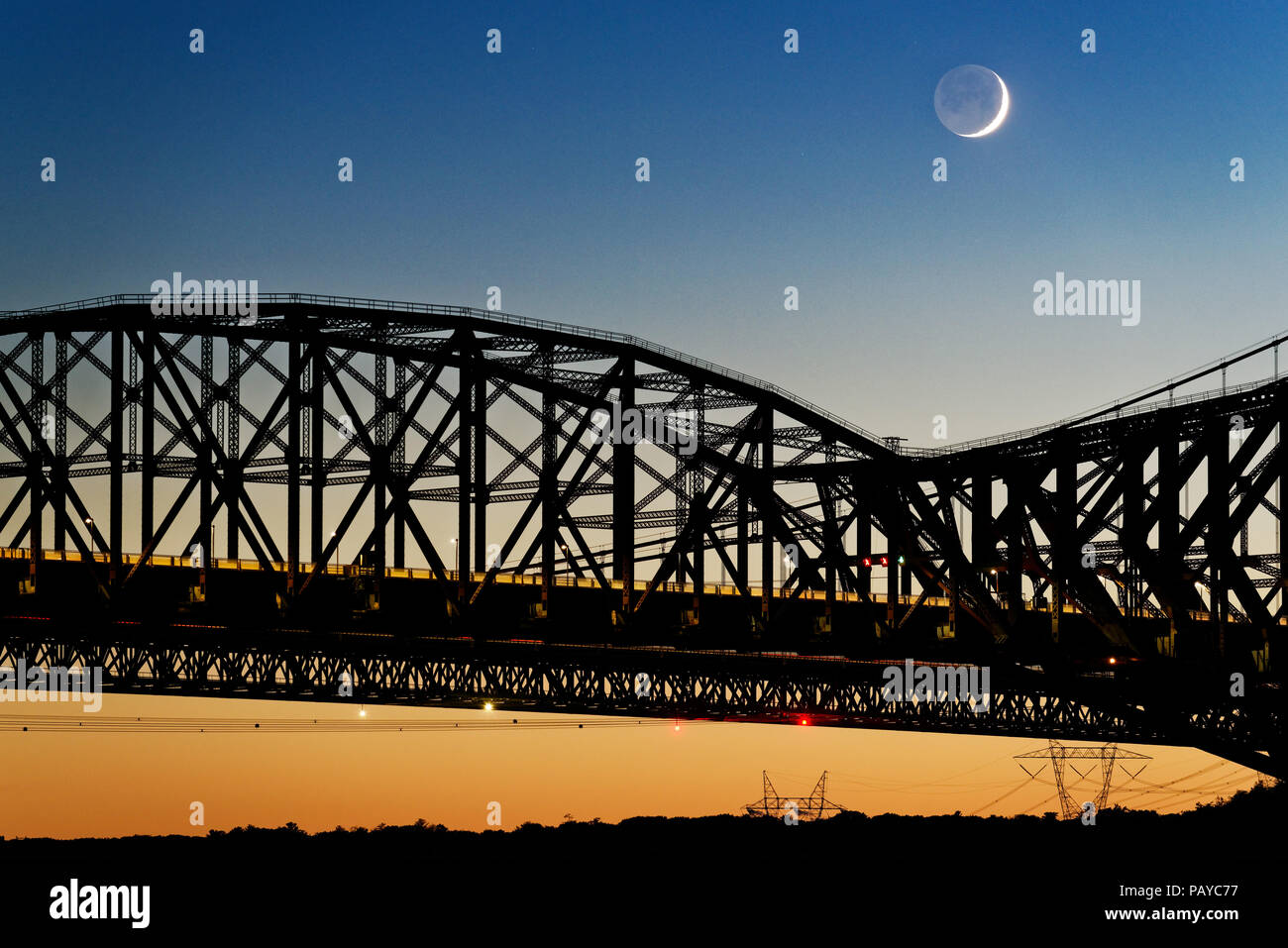 The Pont du Quebec and the St Lawrence River at dusk from Parc de la ...