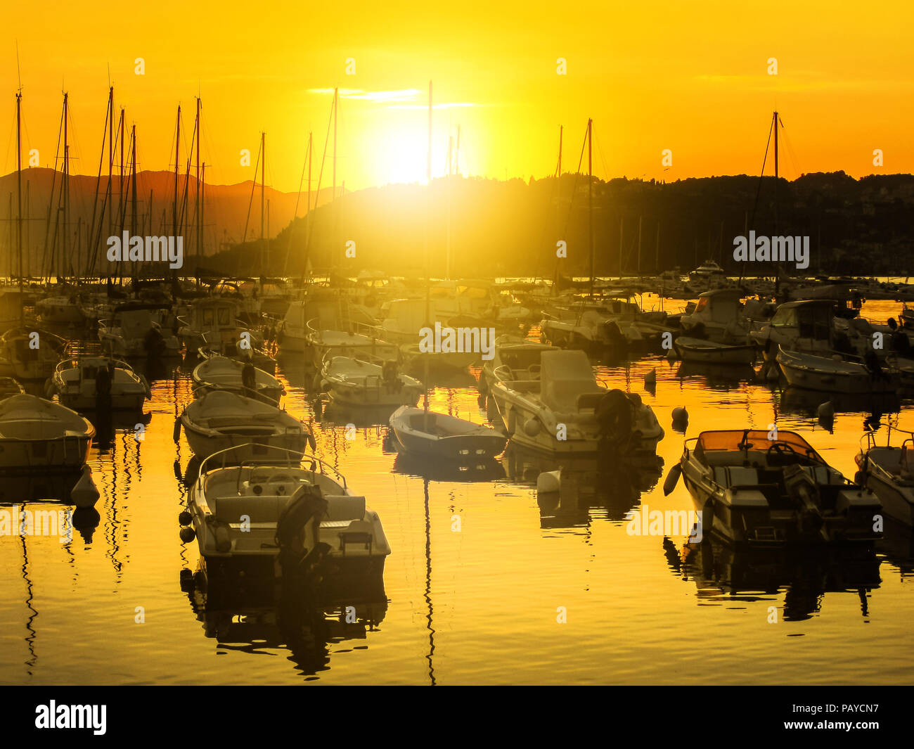 Gulf of Poets with docket boats in Lerici medieval town at sunset light ...