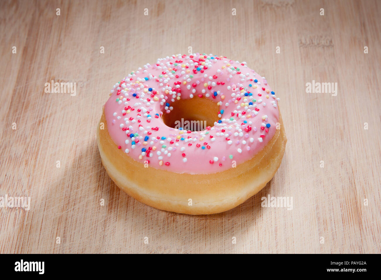 Single delicious donut on wood Stock Photo - Alamy