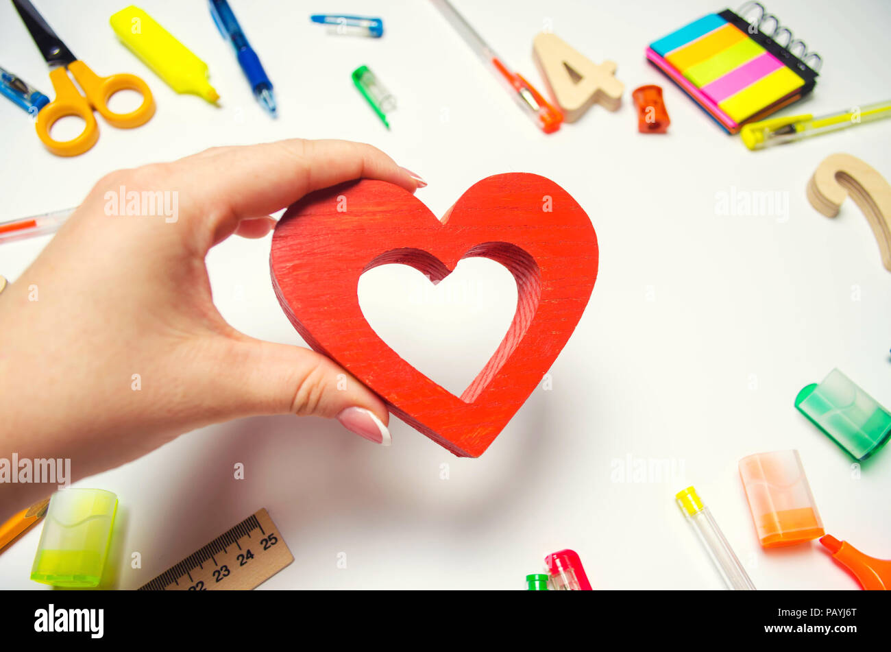 I Love School! the student holds the heart in his hands on the ...