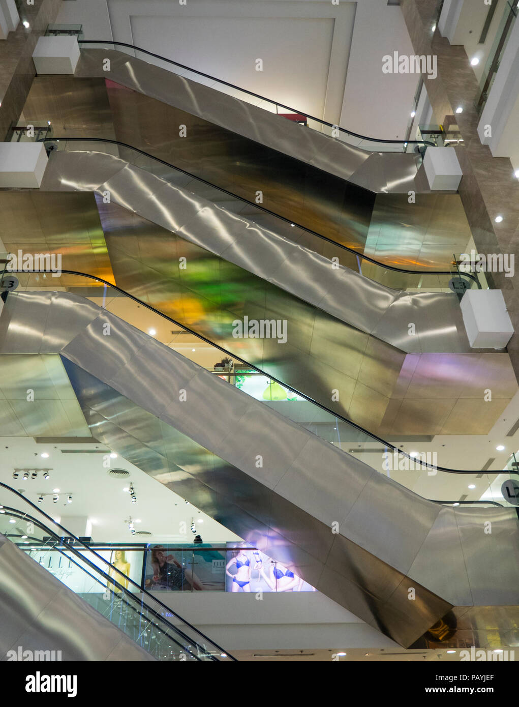 Stainless steel escalators in a shopping centre in Ho Chi Minh City ...