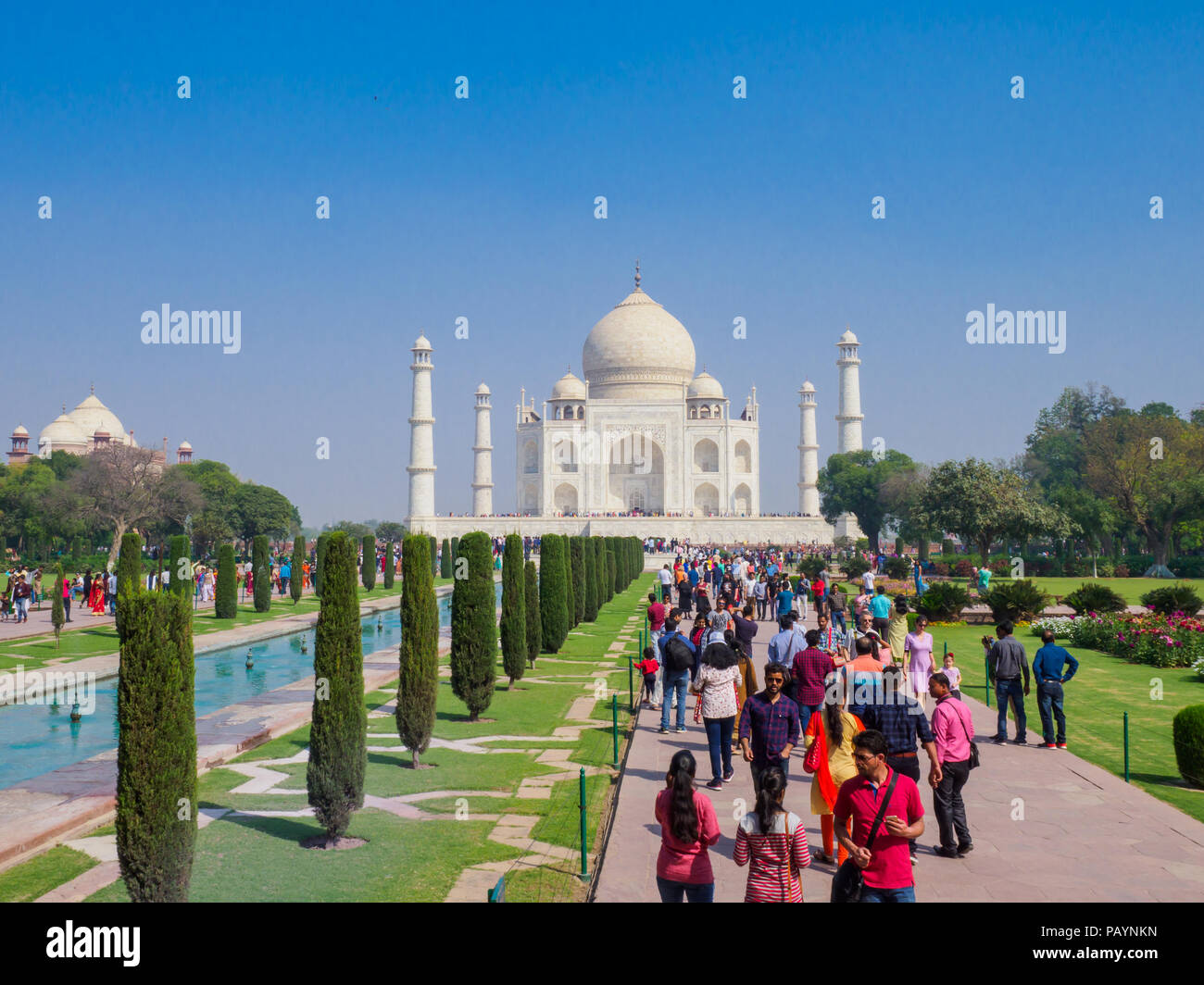 Tourists visiting the Taj Mahal, the ivory-white marble mausoleum in ...