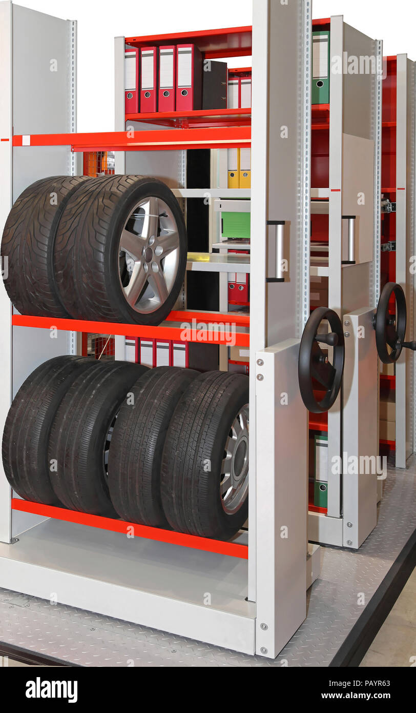 Mobile shelving high density system in storage room Stock Photo - Alamy