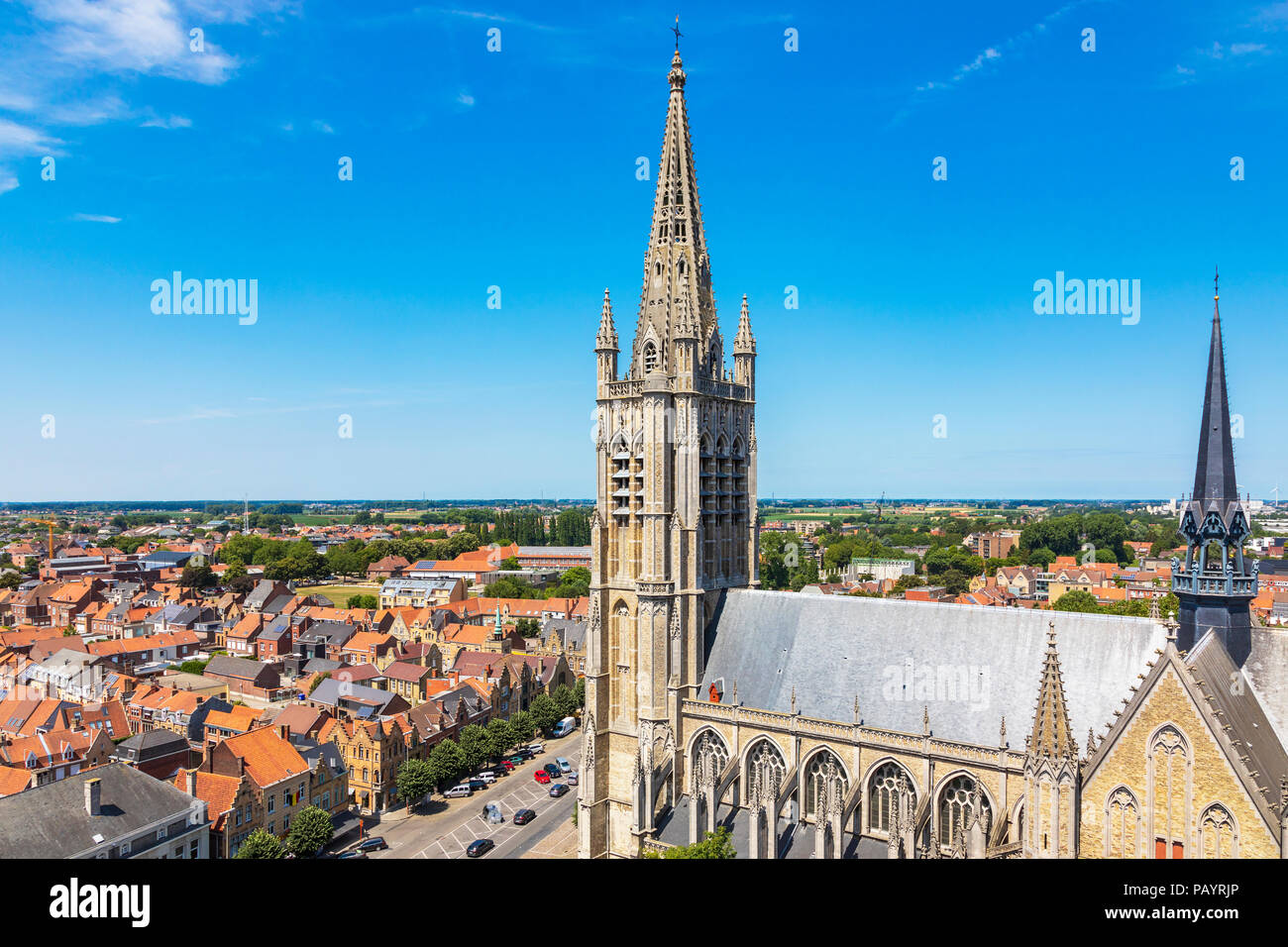 Spire and transept of Ypres cathedral showing the skyline over the town ...