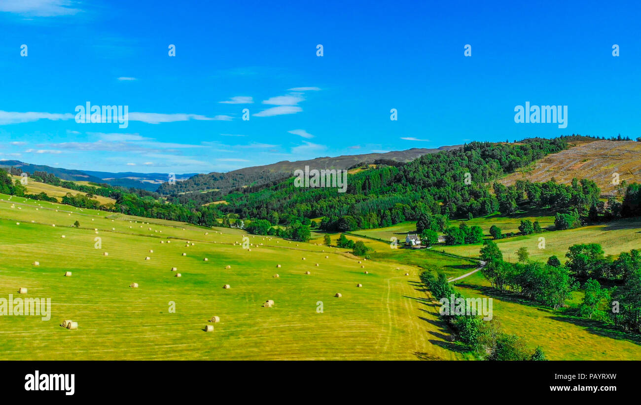 Green fields and farmland with hay bales in Scotland Stock Photo - Alamy