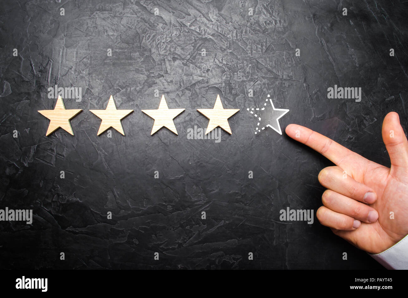 The businessman's hand in the suit points to the fifth star. Get the ...