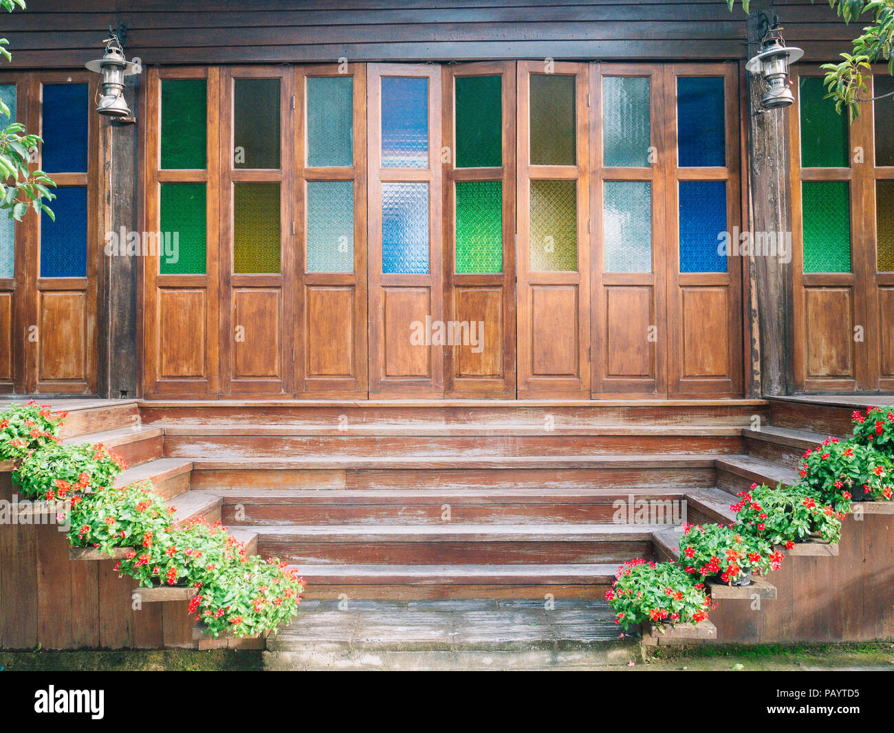 Beautiful variety color wooden windows at wooden home Stock Photo - Alamy
