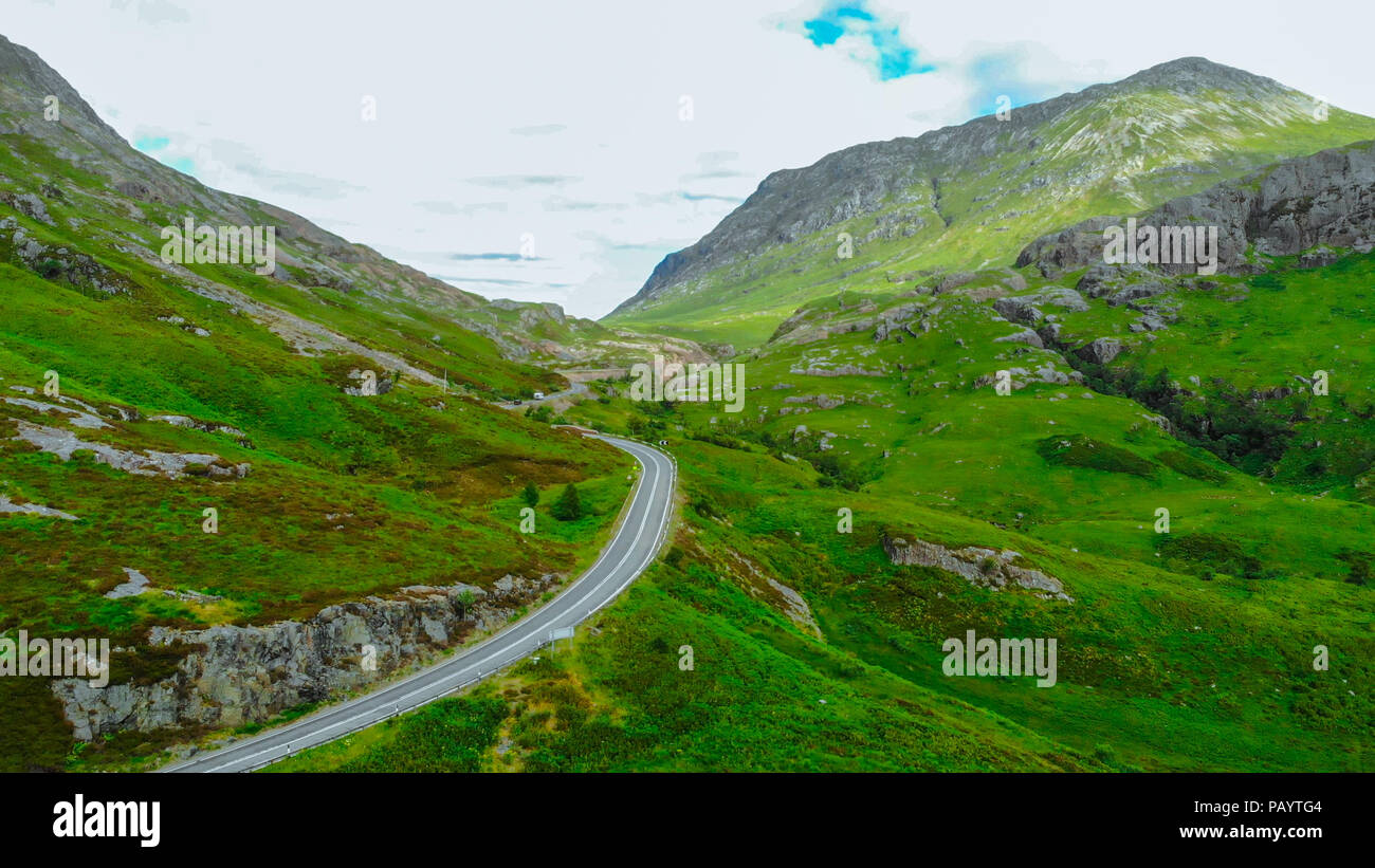 Road through Glencoe valley in the highlands of Scotland - aerial view ...