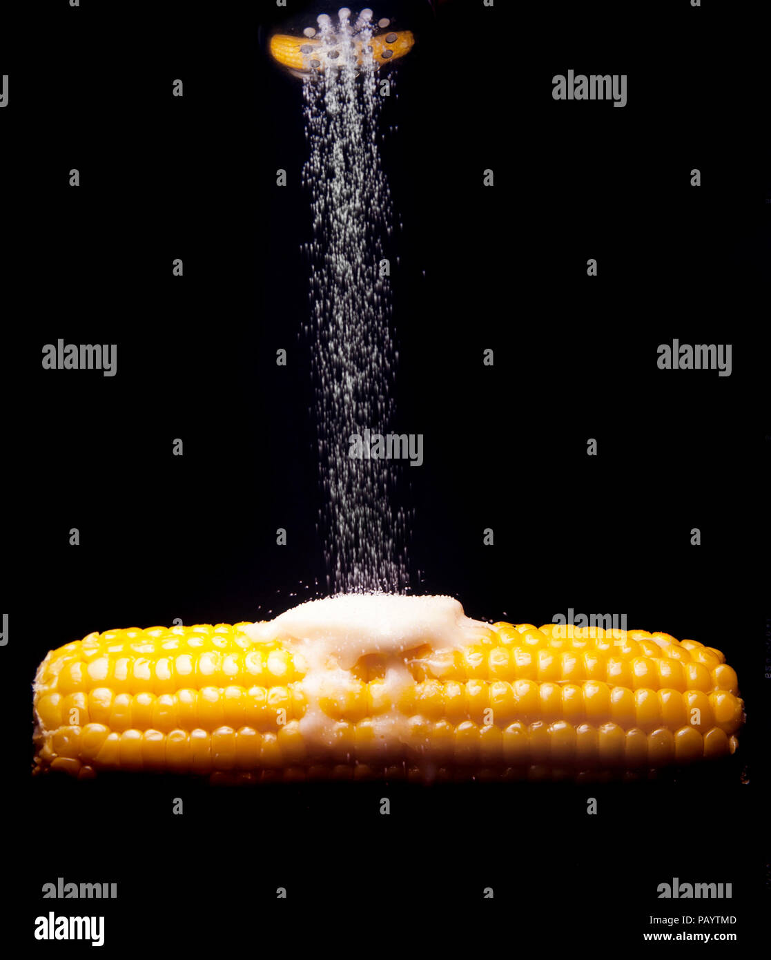 Salt Falling on Corn Stock Photo - Alamy