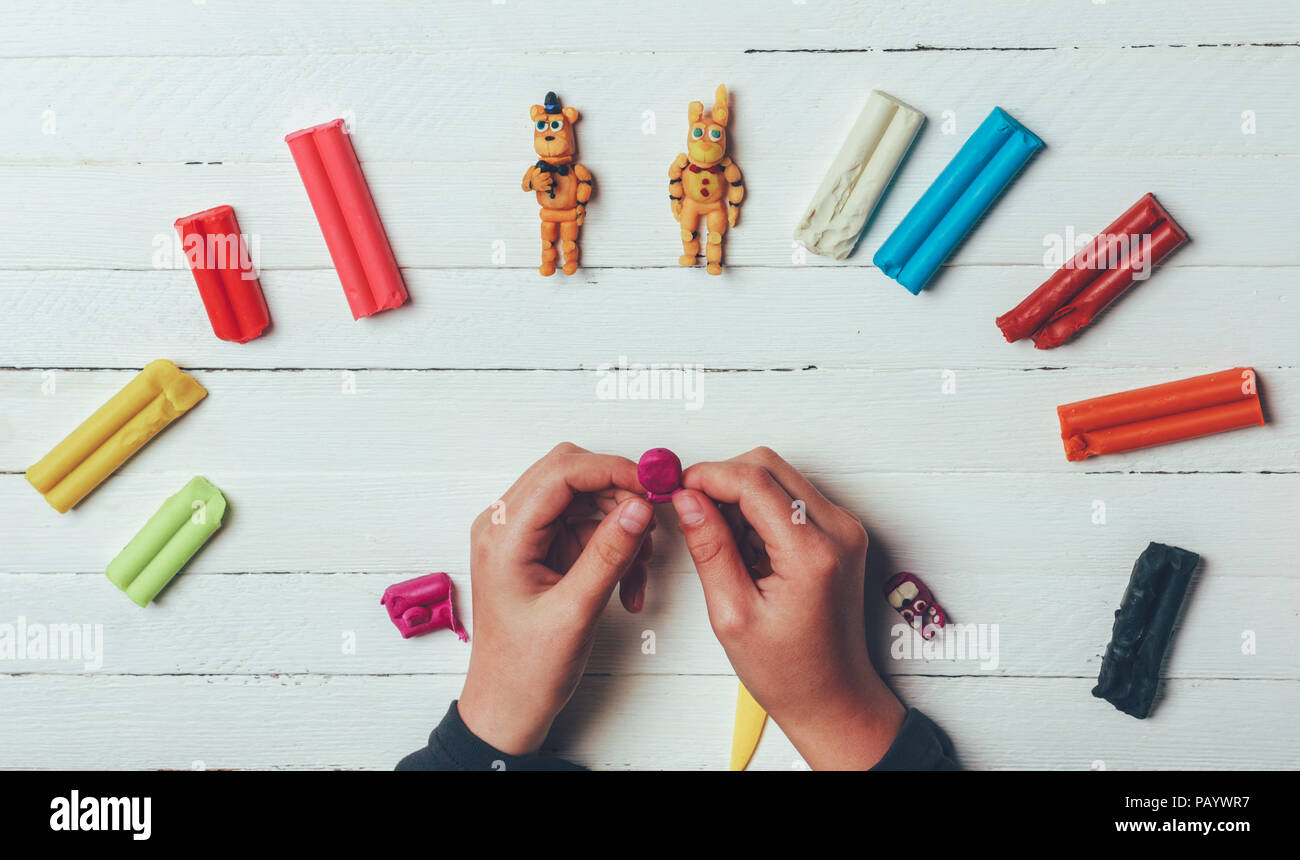 boy sculpts from wax modeling clay figures of animatronics heroes of ...