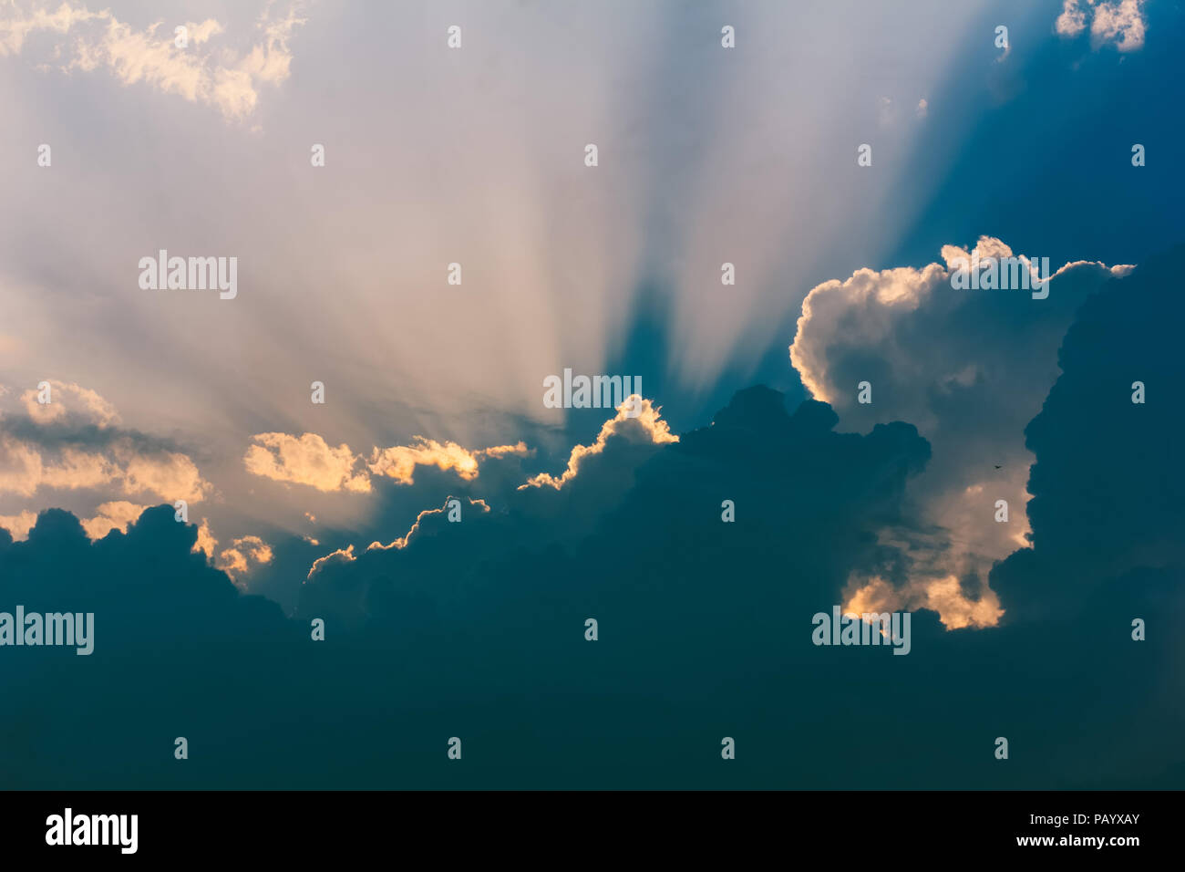 landscape sky with rays of the sun breaking through the storm clouds ...