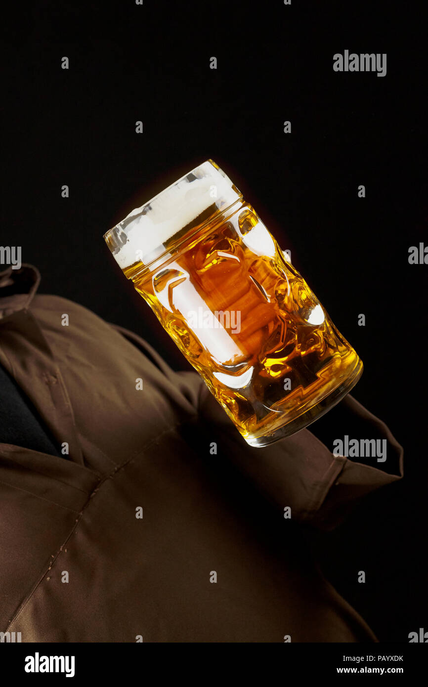 Delicious beer in a giant glass mug, held by a friar, dutch angle shot ...