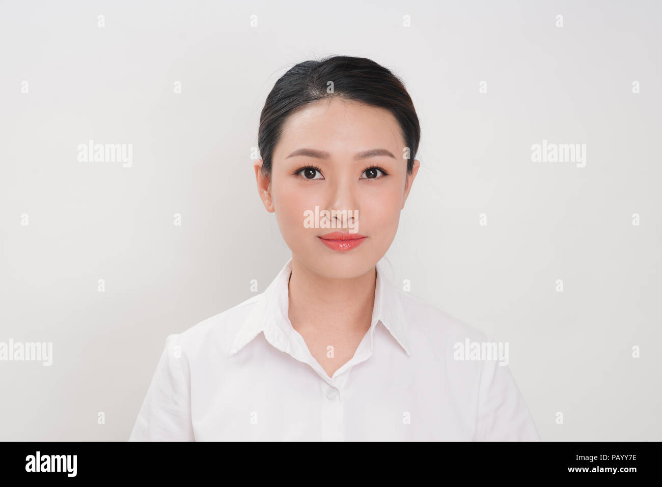 Portrait of happy beautiful young businesswoman smiling looking at ...
