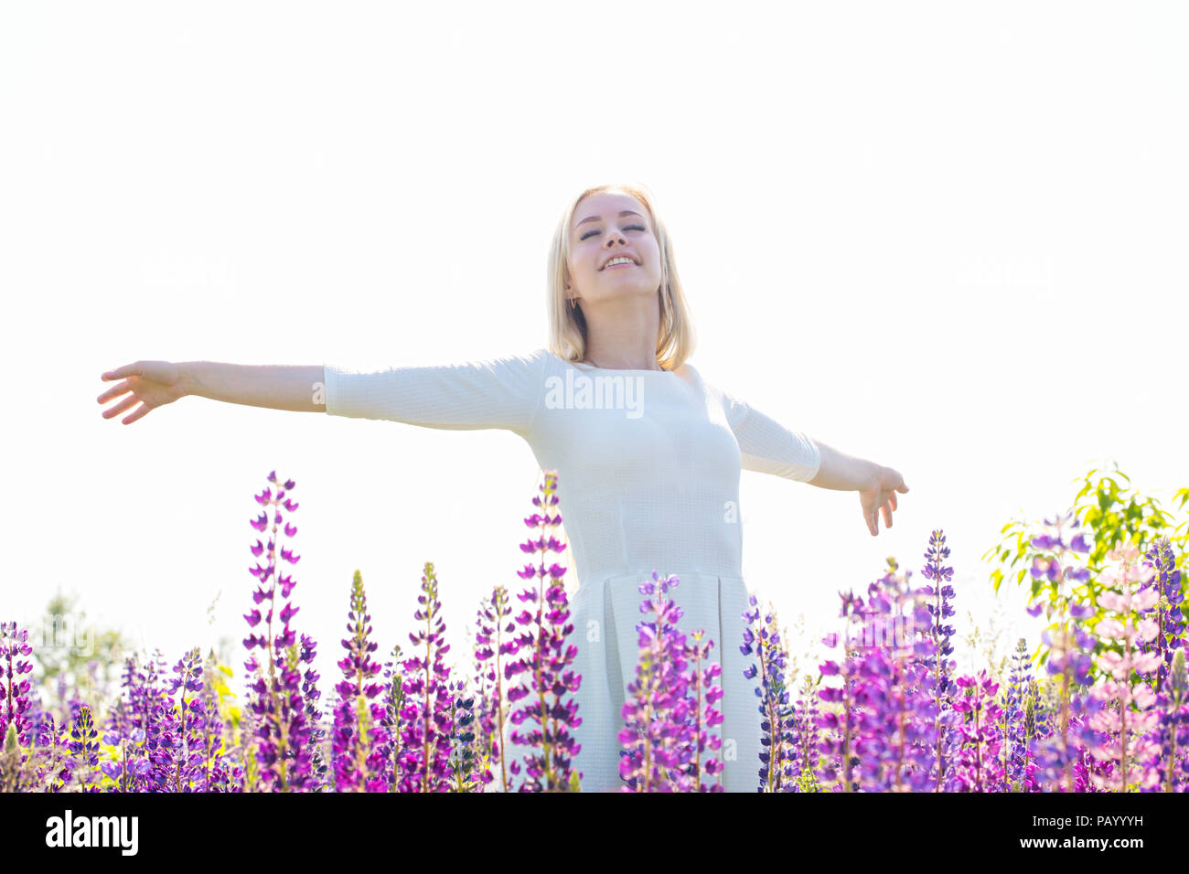 Happy girl dancing on the field Stock Photo - Alamy