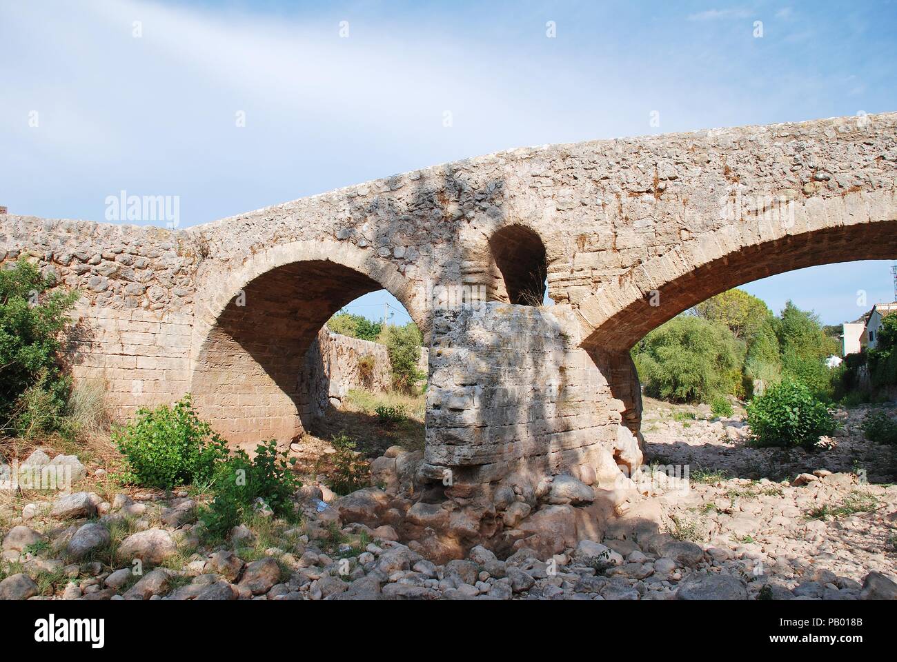 The Roman bridge across the Torrent de Sant Jordi in Pollenca on the ...
