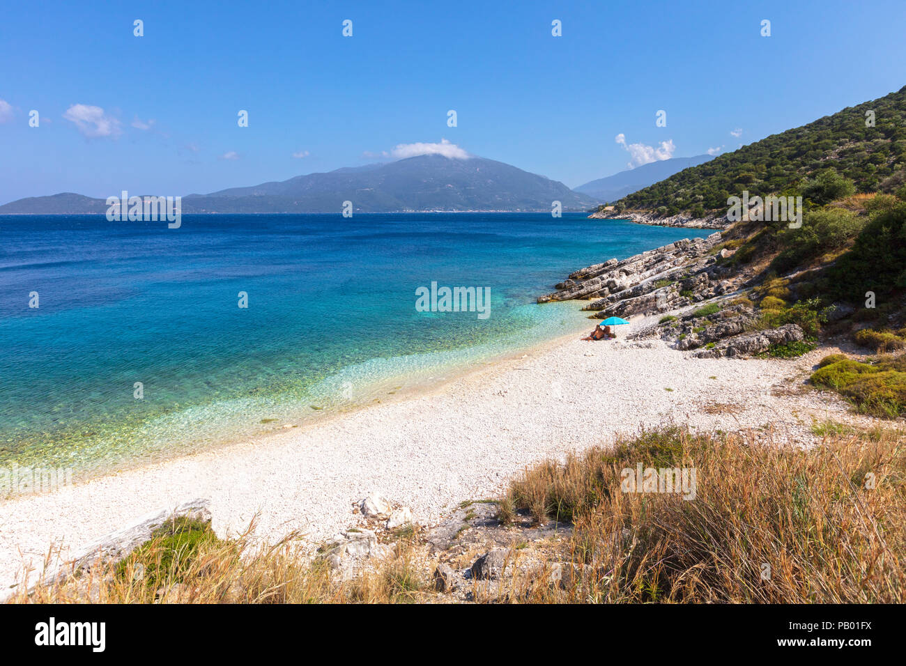 Small cozy beach with white sand and azure water Stock Photo - Alamy