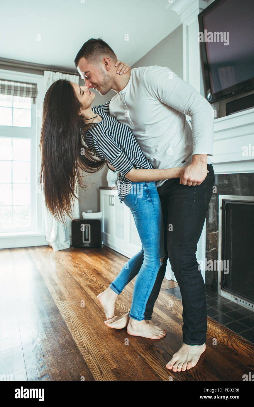 Portrait of beautiful romantic young smiling laughing couple man woman ...