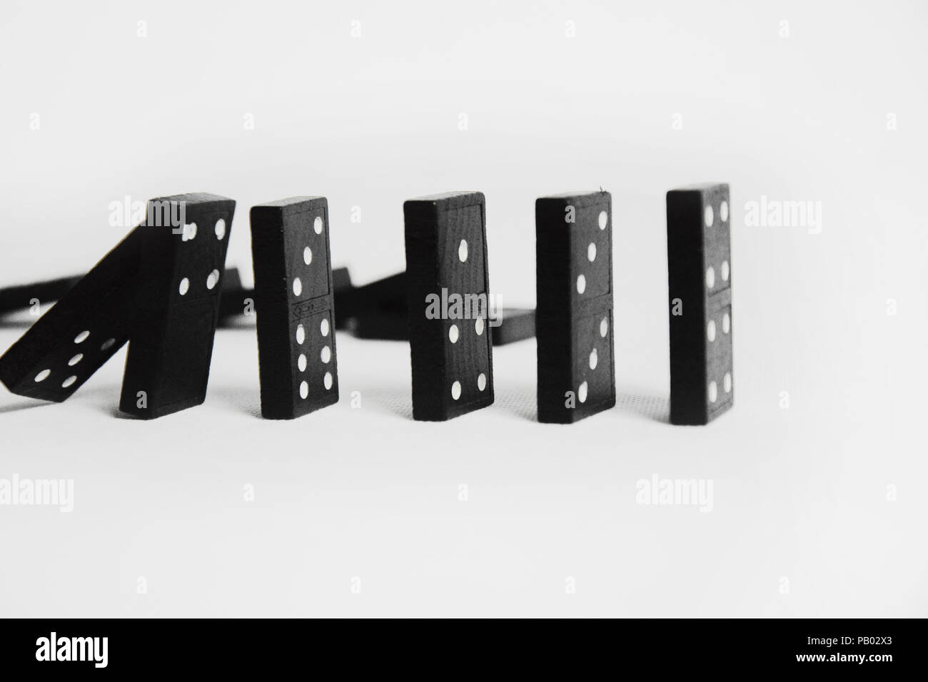 Trigger chain reaction domino hi-res stock photography and images - Alamy