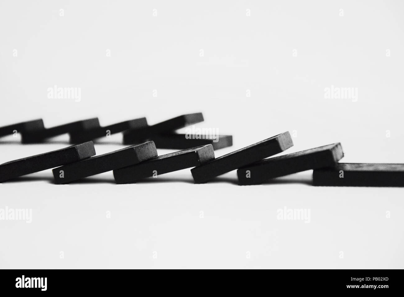 Falling Domino Pieces Stock Photo - Alamy