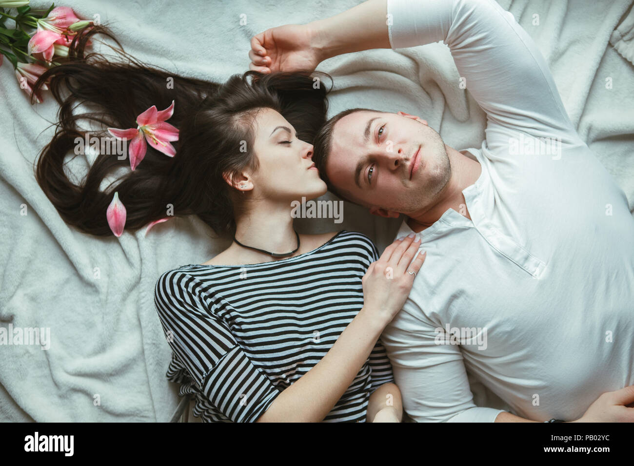 Portrait of beautiful romantic young couple man woman in love hugging ...