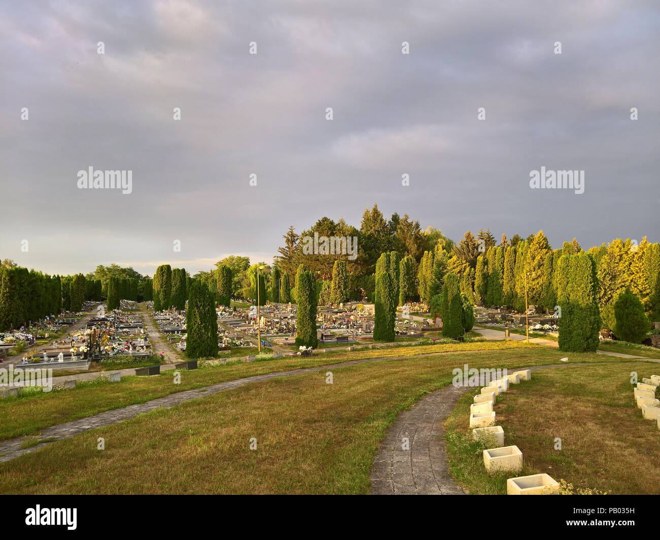 Christian cemetery with graves and spaces for cremation Stock Photo - Alamy