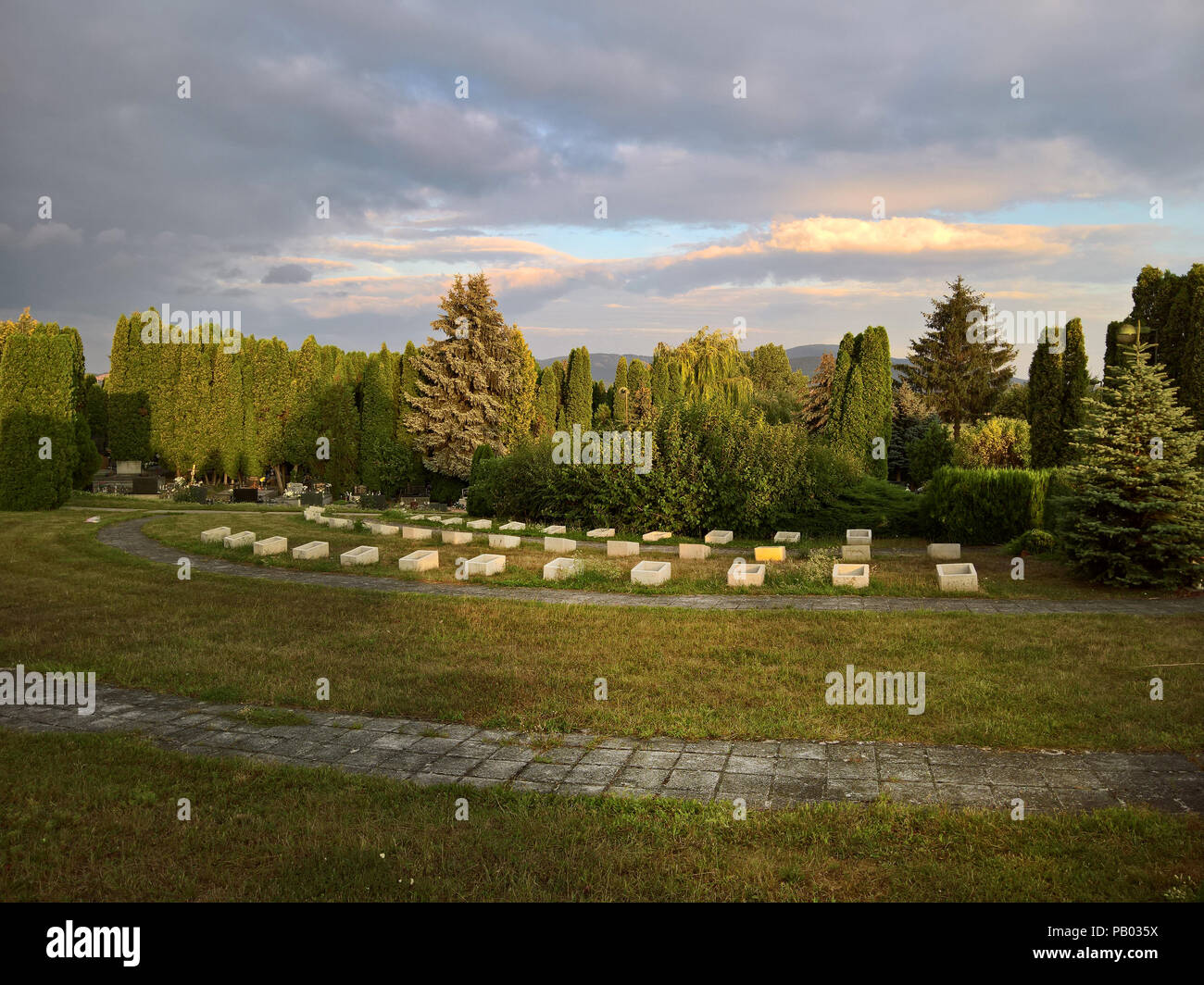 Christian cemetery with graves and spaces for cremation Stock Photo - Alamy