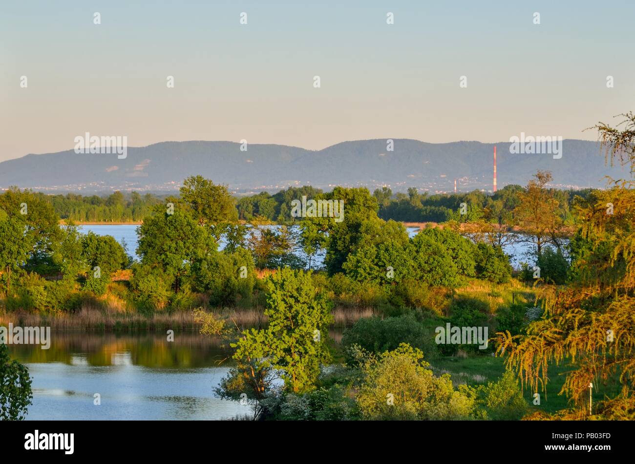Spring evening landscape. Beautiful lakes and mountains in the ...