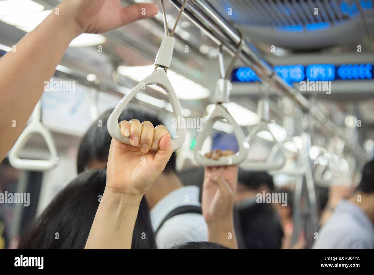People inside the crowded metro train. Singapore Stock Photo - Alamy