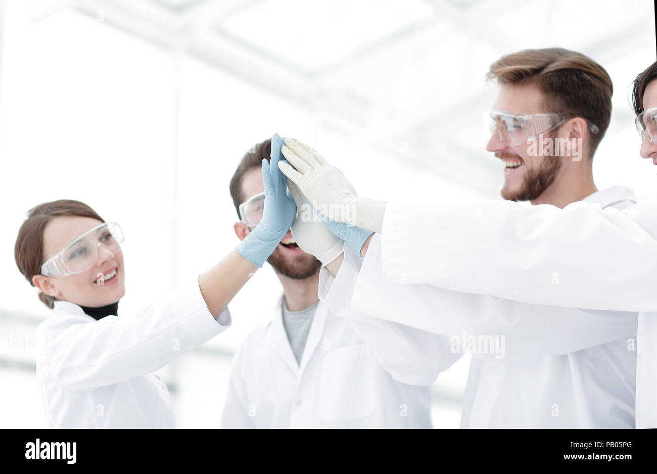 Research team high five hi-res stock photography and images - Alamy